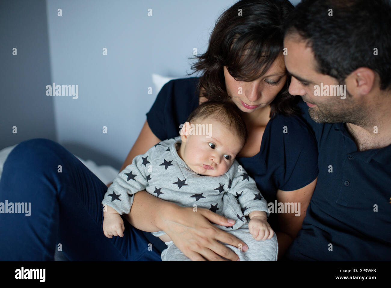 Parents with baby boy Stock Photo - Alamy