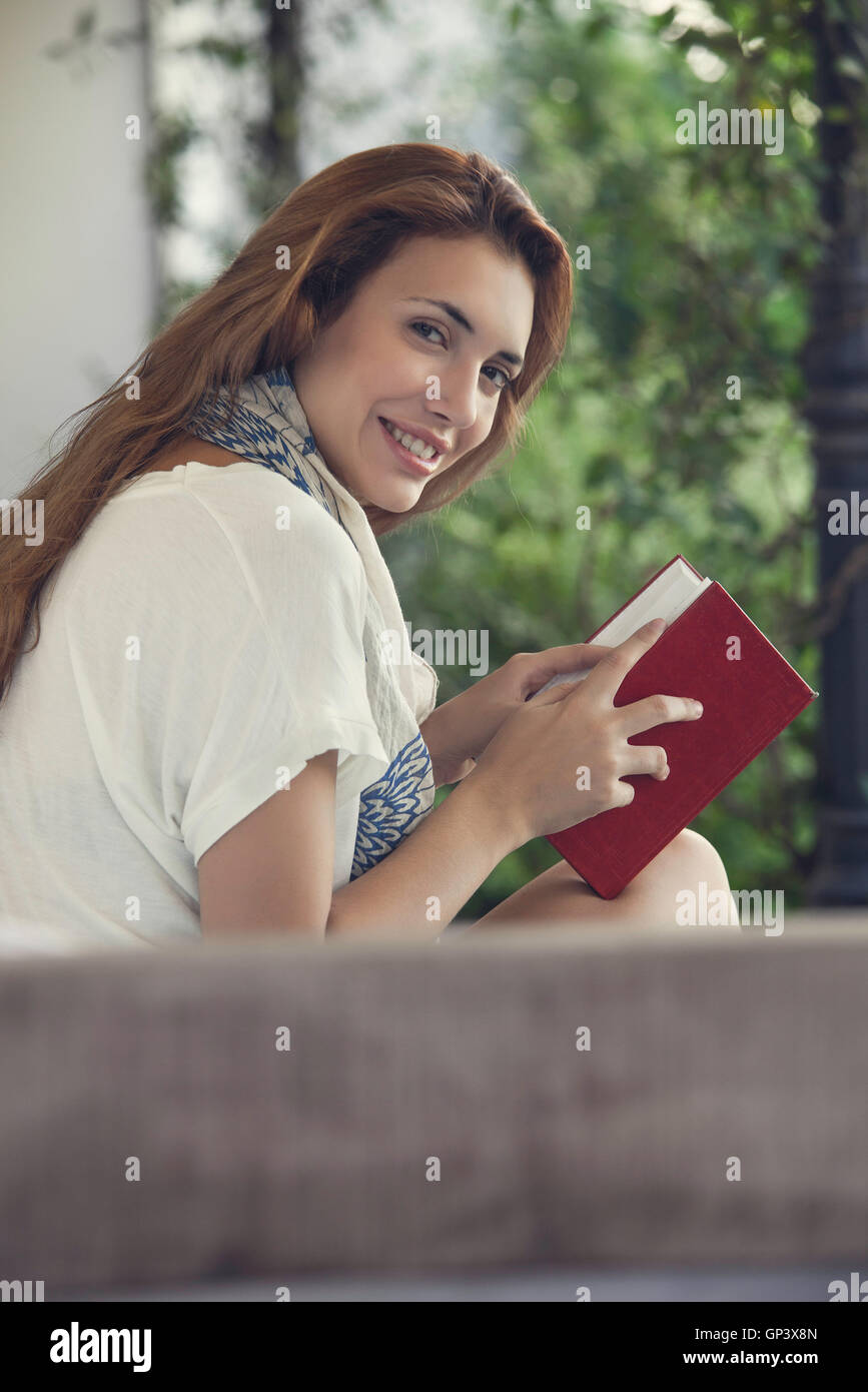 Woman reading book Stock Photo - Alamy