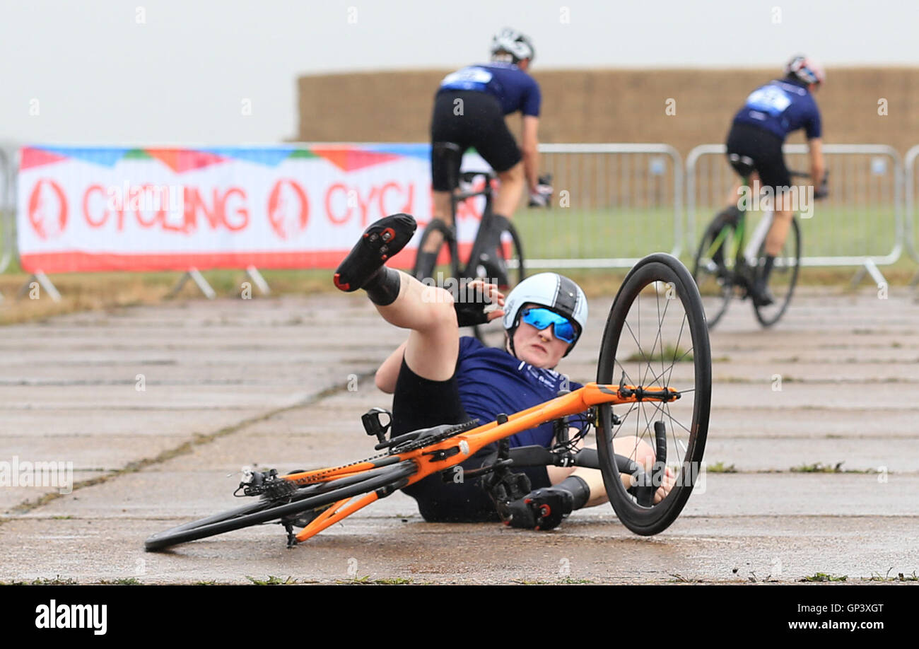 A cyclist falls off his bike during the team time trial road Cycling on ...