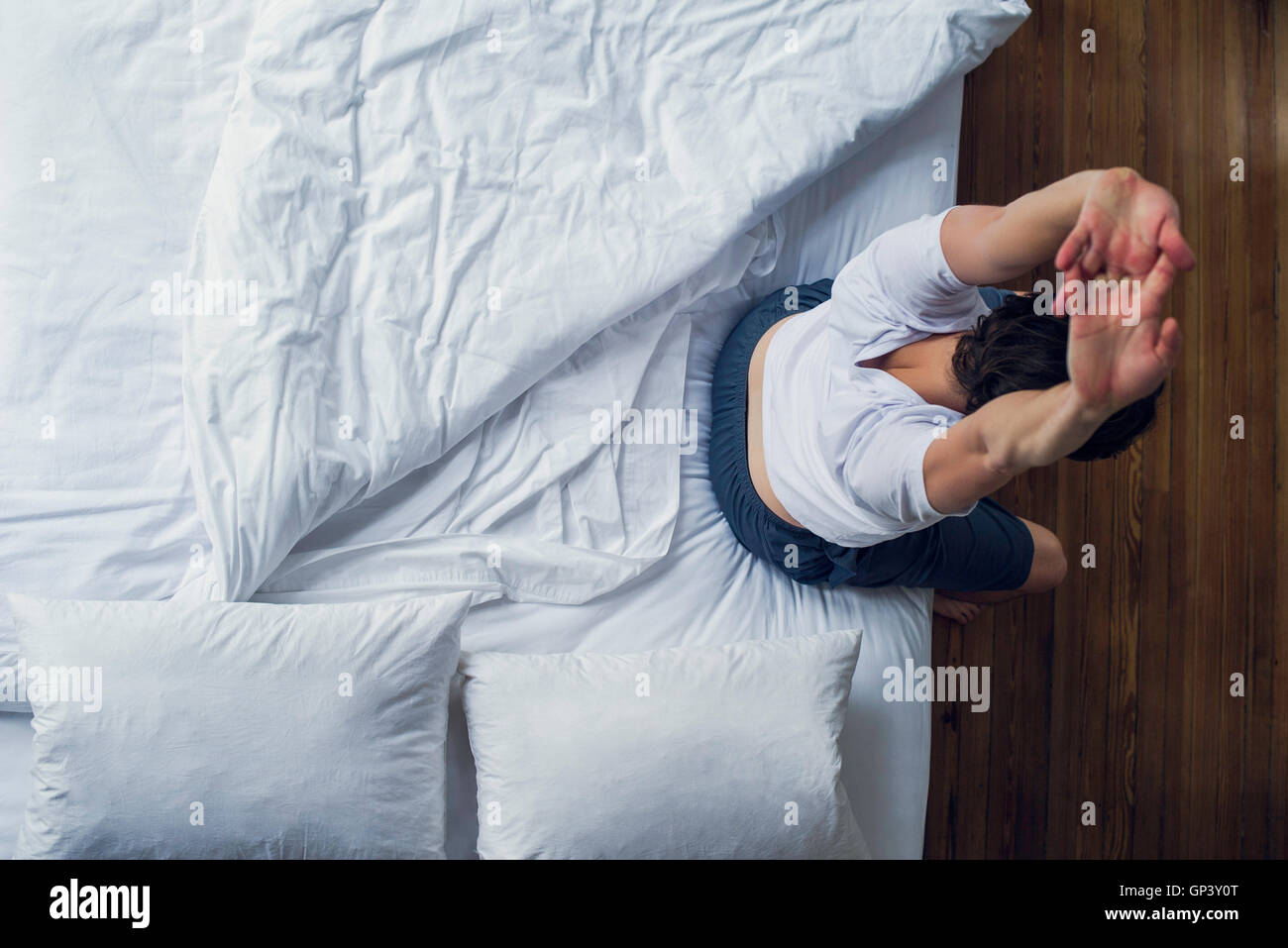 Man stretching arm overhead hi-res stock photography and images - Alamy