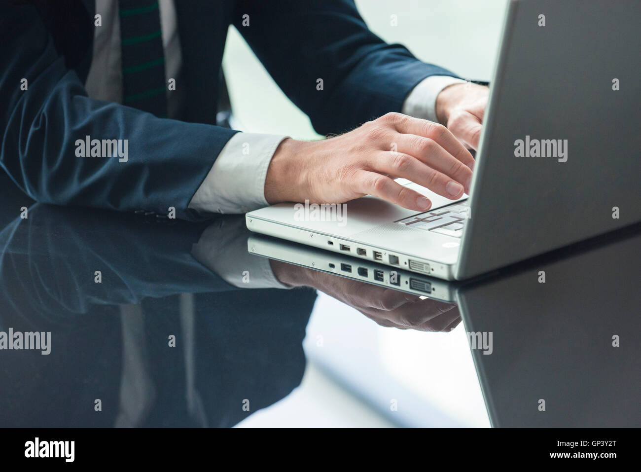 Businessman using laptop computer Stock Photo - Alamy