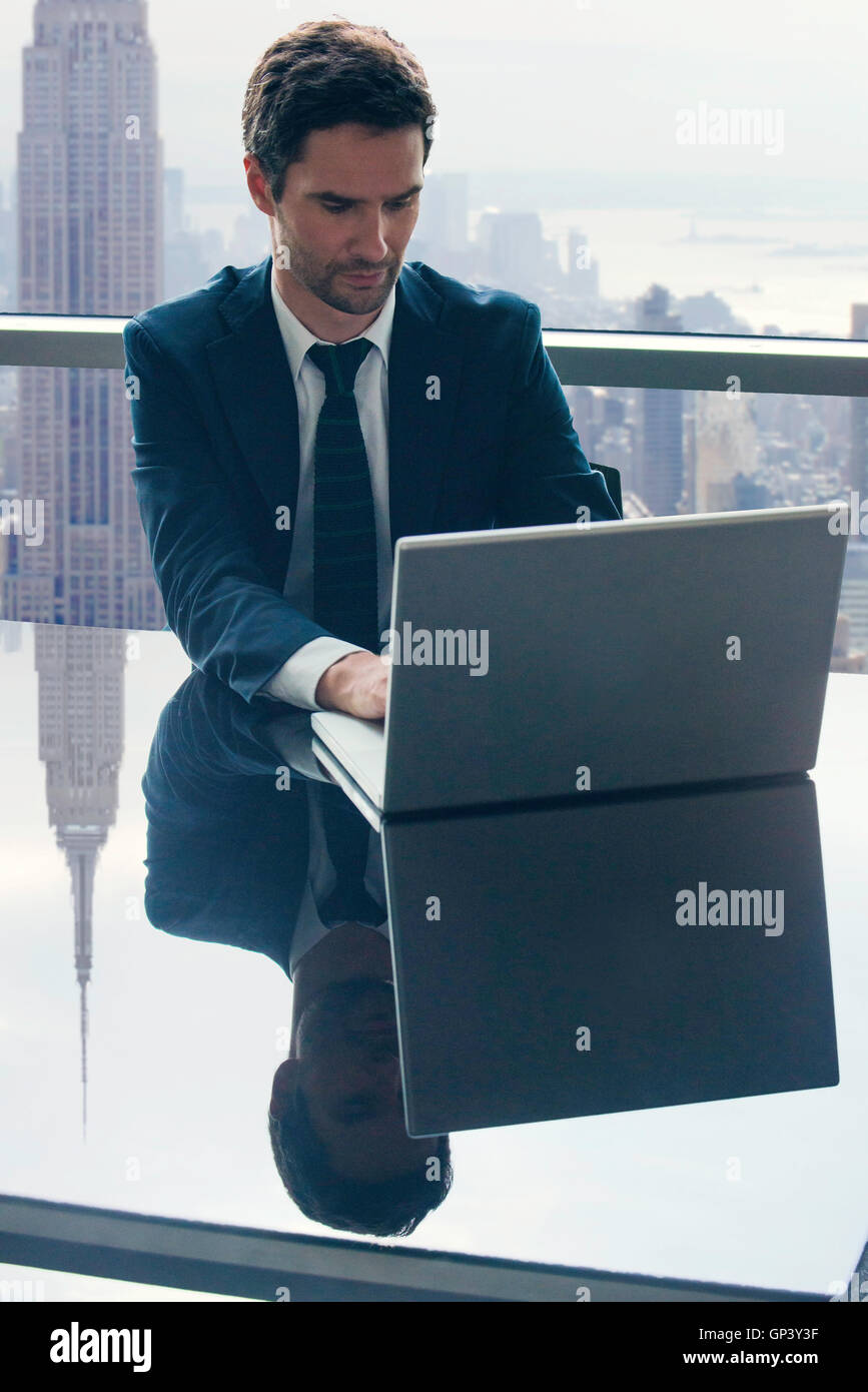 Businessman using laptop computer Stock Photo - Alamy