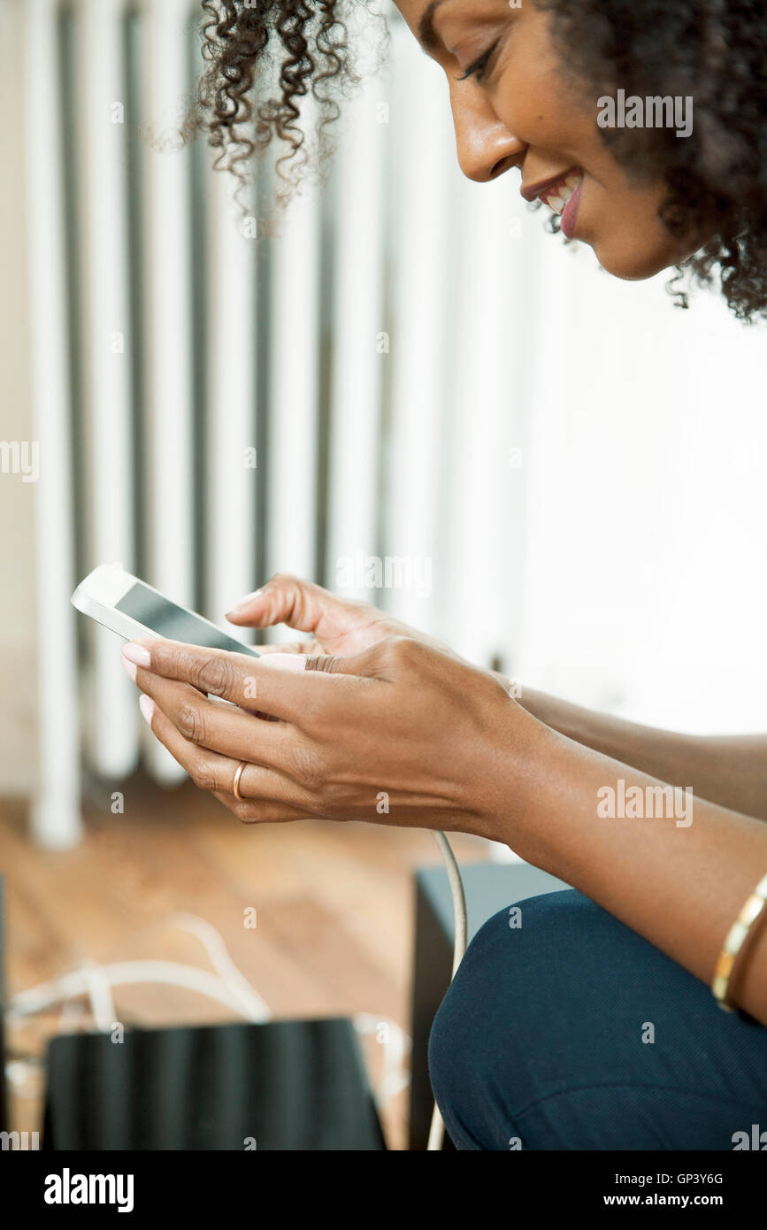 Woman text messaging Stock Photo - Alamy