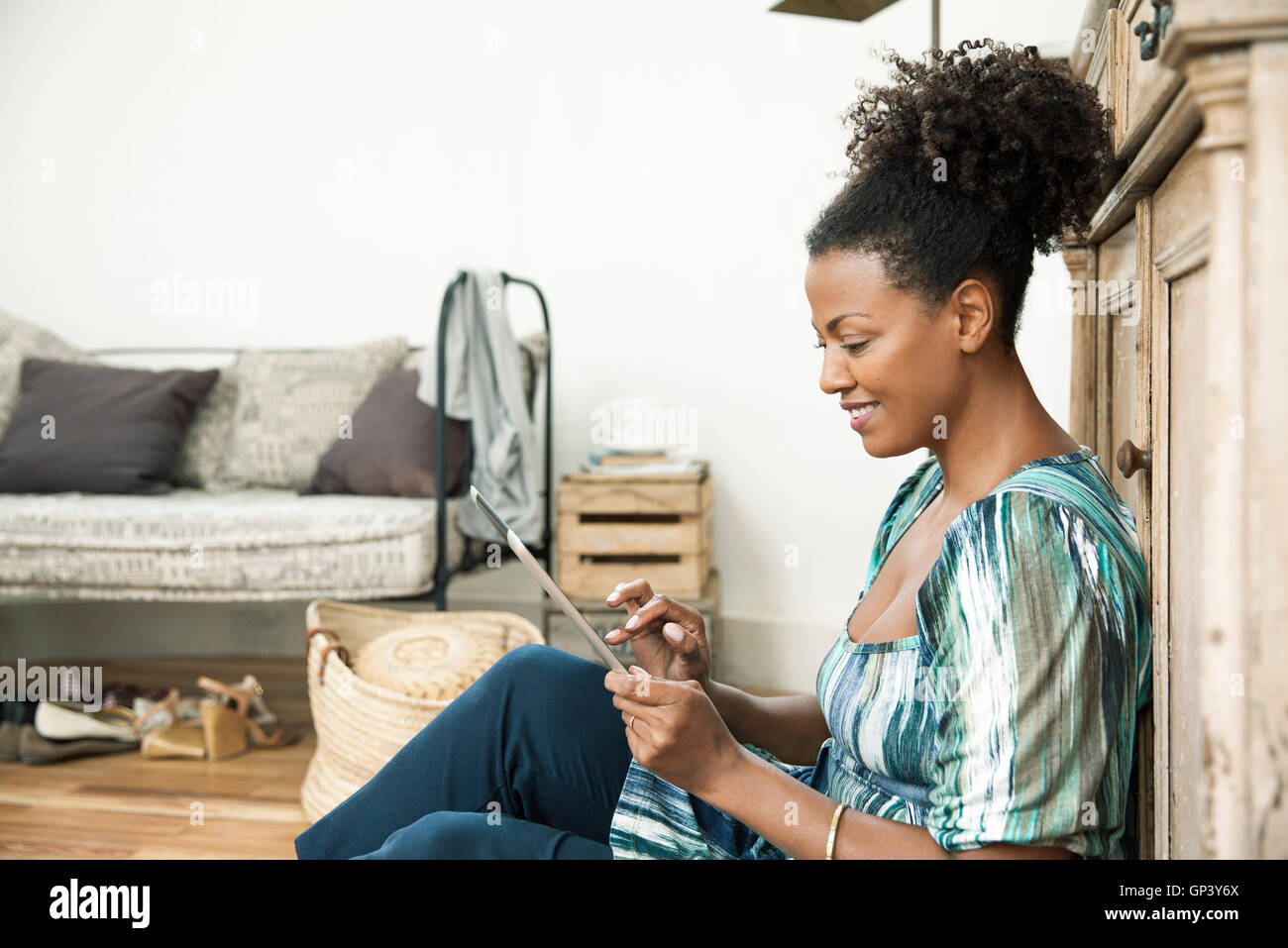 Woman using digital tablet at home Stock Photo - Alamy
