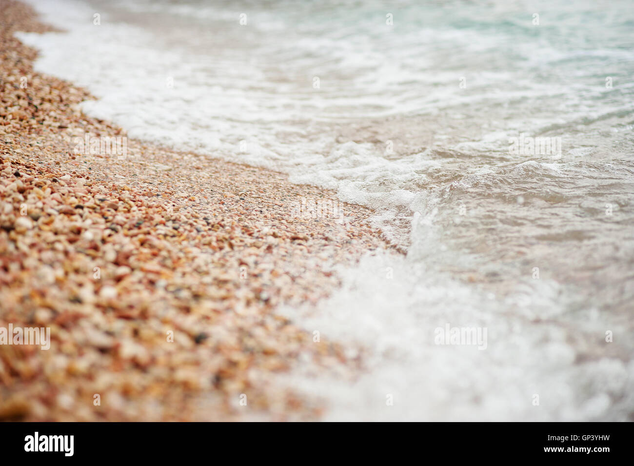 Sea pebbles, ocean, wave, coast Stock Photo - Alamy