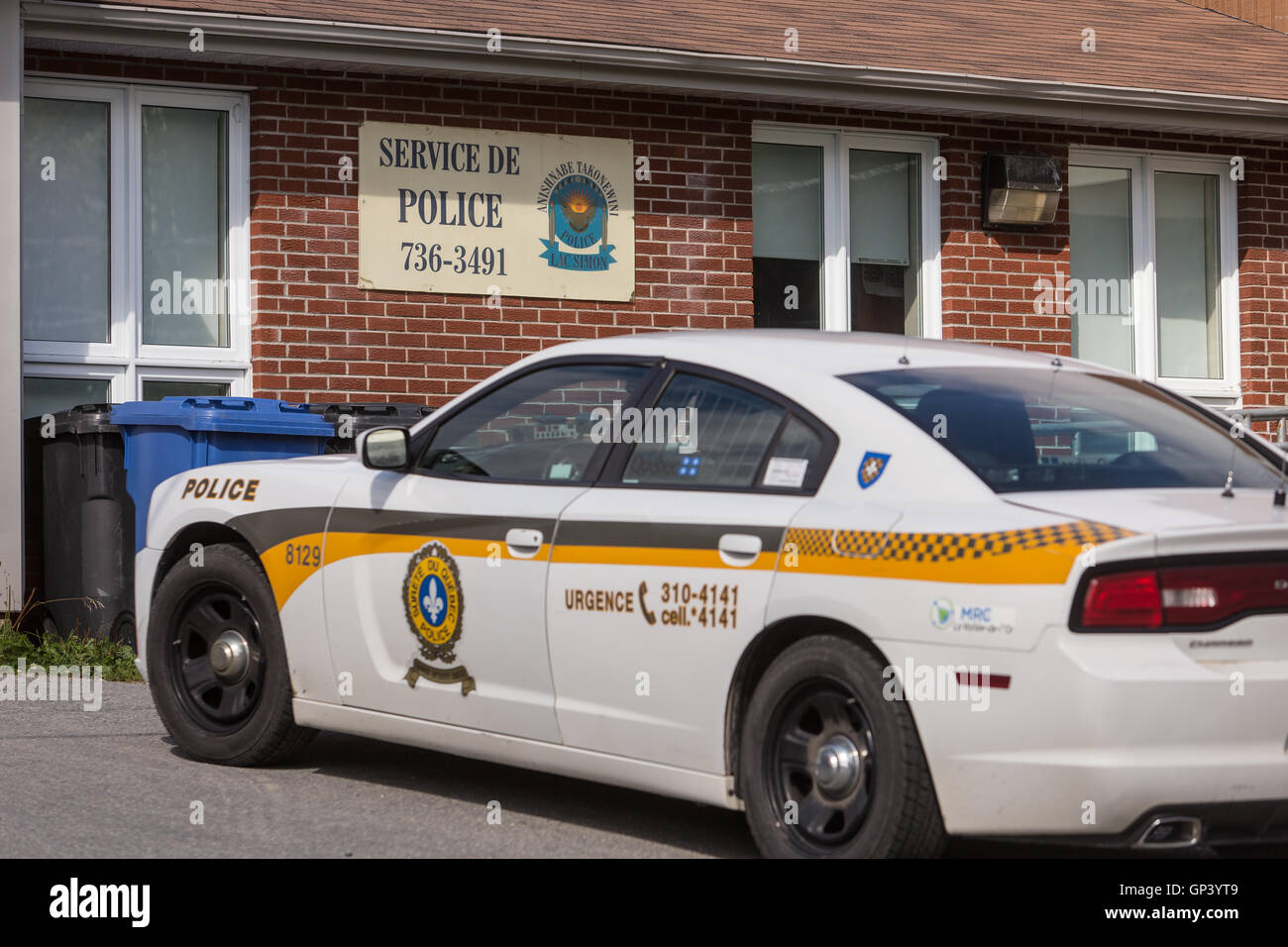 A Surete du Quebec police car is parked by a police station in the ...
