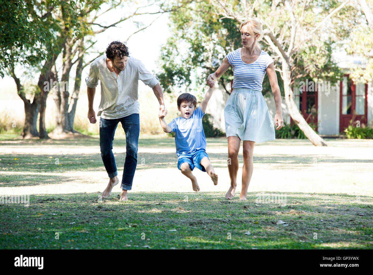 Family with one child taking walk outdoors together Stock Photo - Alamy