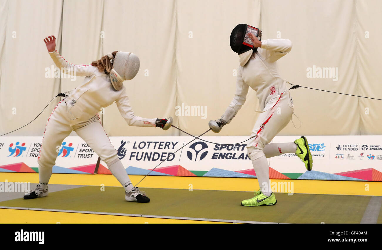 England's Eliza Woodhouse (left) in action against Northern Ireland's ...