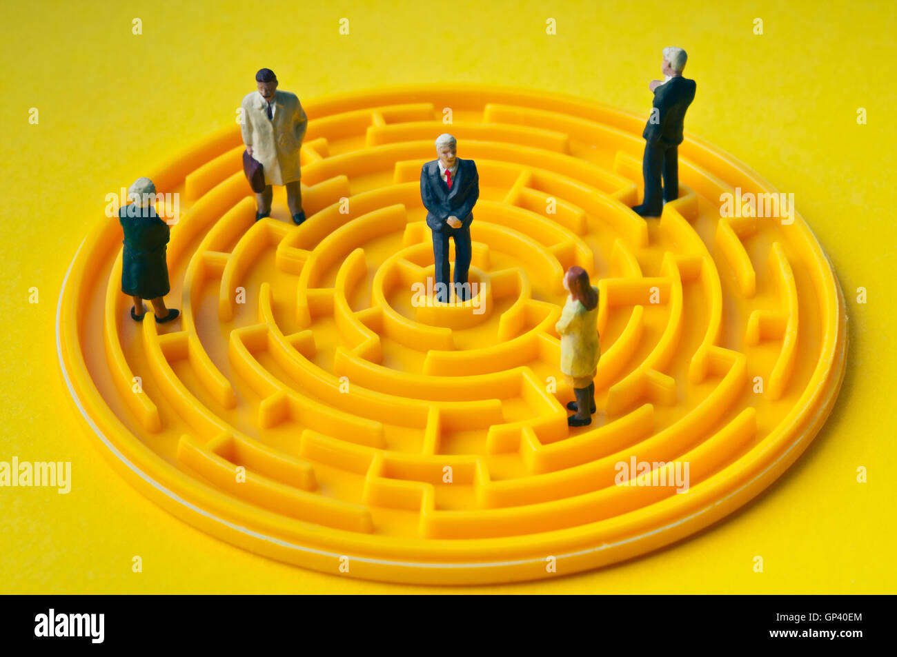 miniature figurines of people in a maze Stock Photo - Alamy