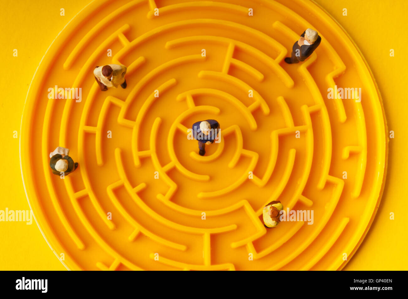 miniature figurines of people in a maze Stock Photo - Alamy