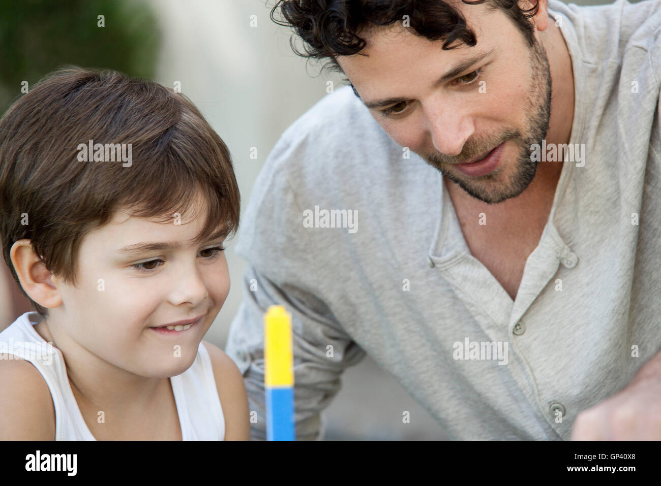 Father and son playing with toys together Stock Photo - Alamy