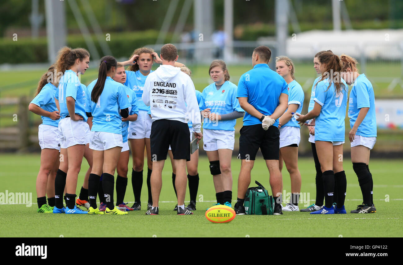 England Midlands (light blue) have a team talk at half time during the ...