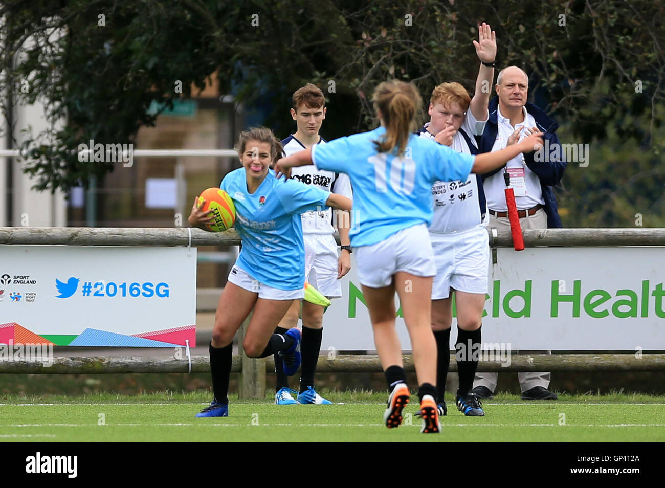 England Midlands (light blue) and celebrate scoring a try during the ...