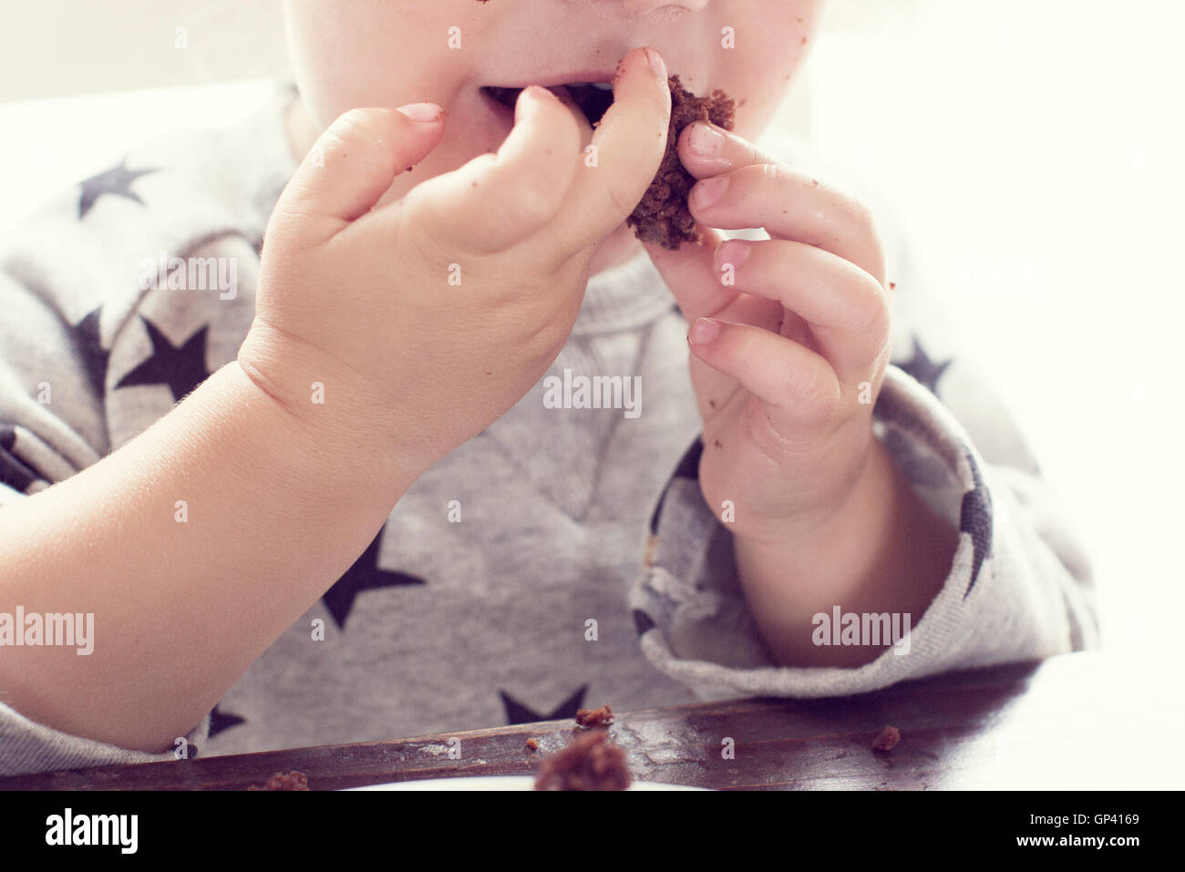 Child eating messy cake hi-res stock photography and images - Alamy