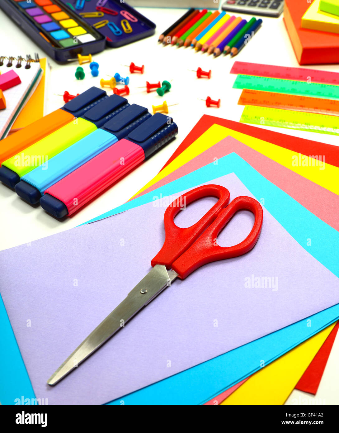 School supplies background, colorful paper, markers, pencils and other ...