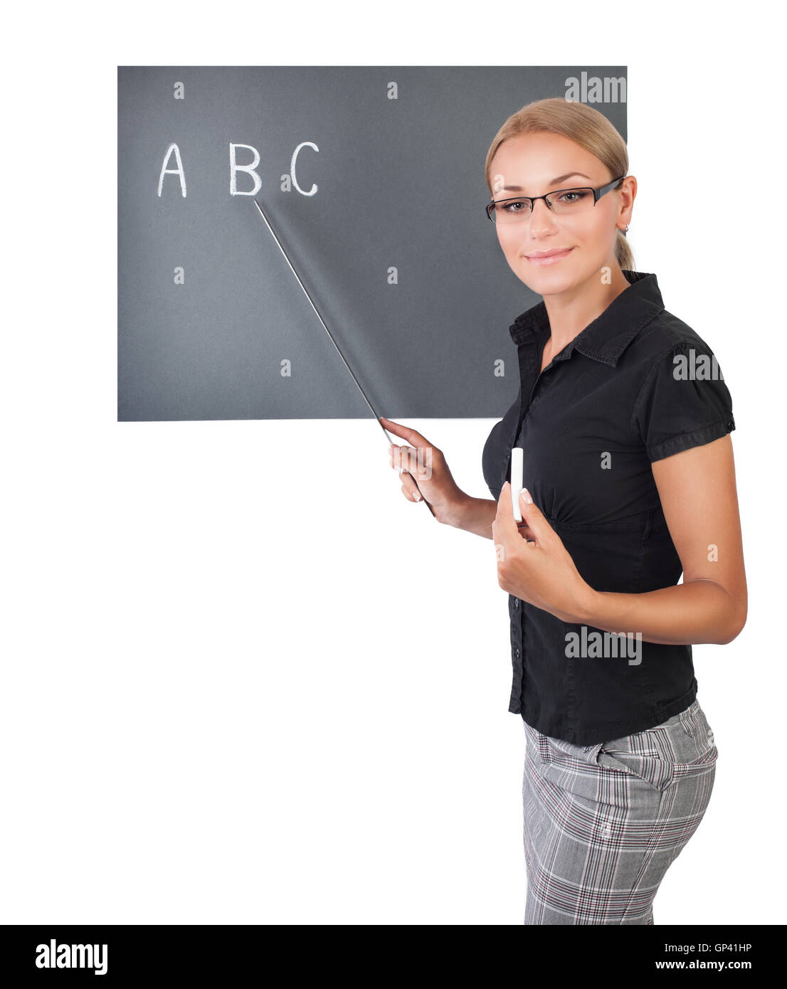 Portrait of a young pretty teacher with chalk and pointer in hands ...