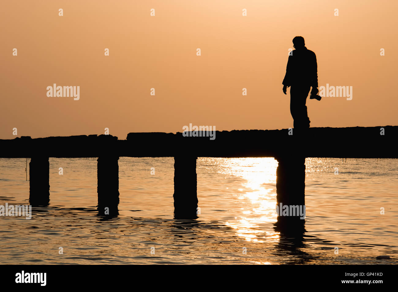 Cloudy skies pedestrian bridge Sunrise Stock Photo - Alamy