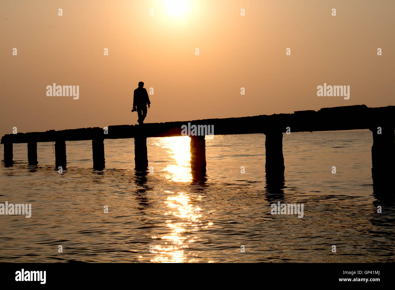 Cloudy skies pedestrian bridge Sunrise Stock Photo - Alamy