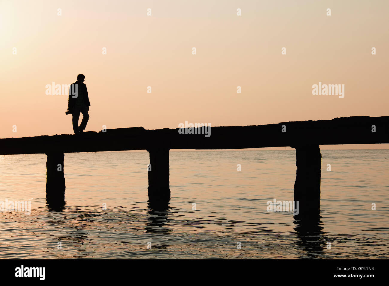 Cloudy skies pedestrian bridge Sunrise Stock Photo - Alamy