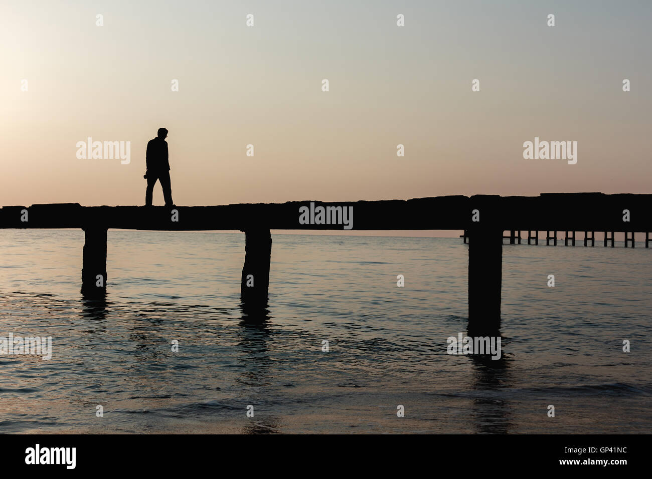 Cloudy skies pedestrian bridge Sunrise Stock Photo - Alamy