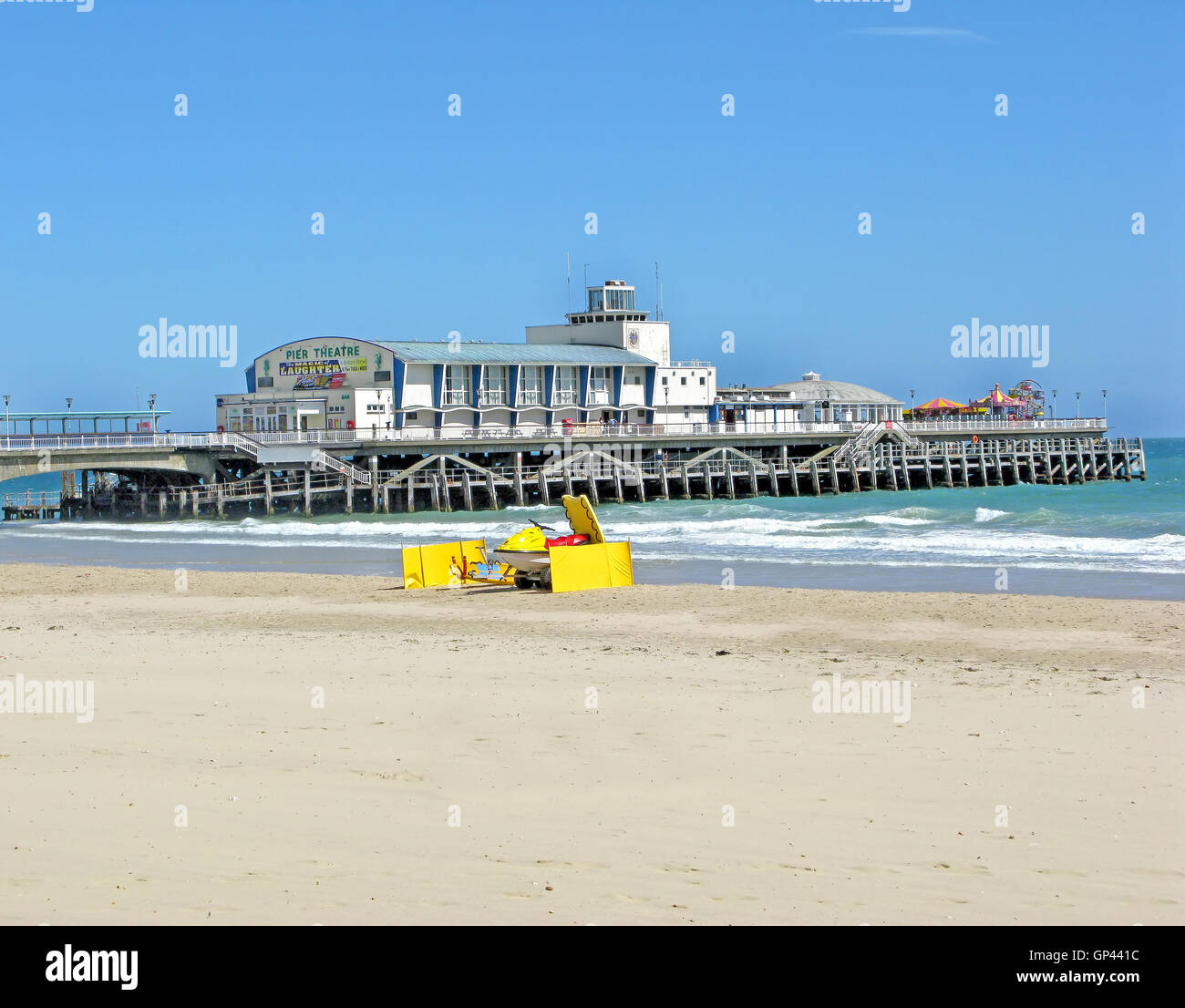 A view of a beach, sea and a pier Stock Photo - Alamy