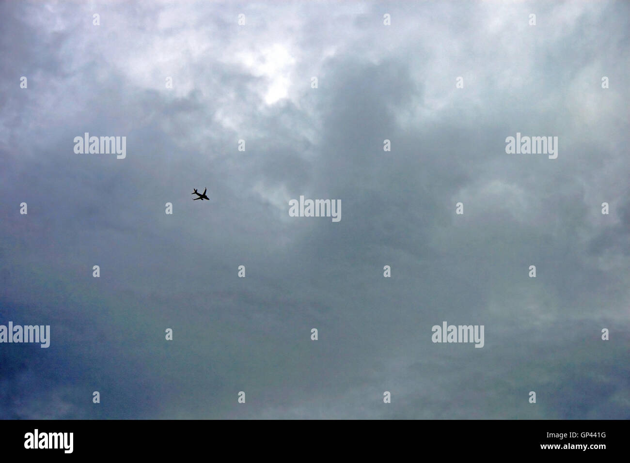 Airplane flying through storm clouds hi-res stock photography and ...