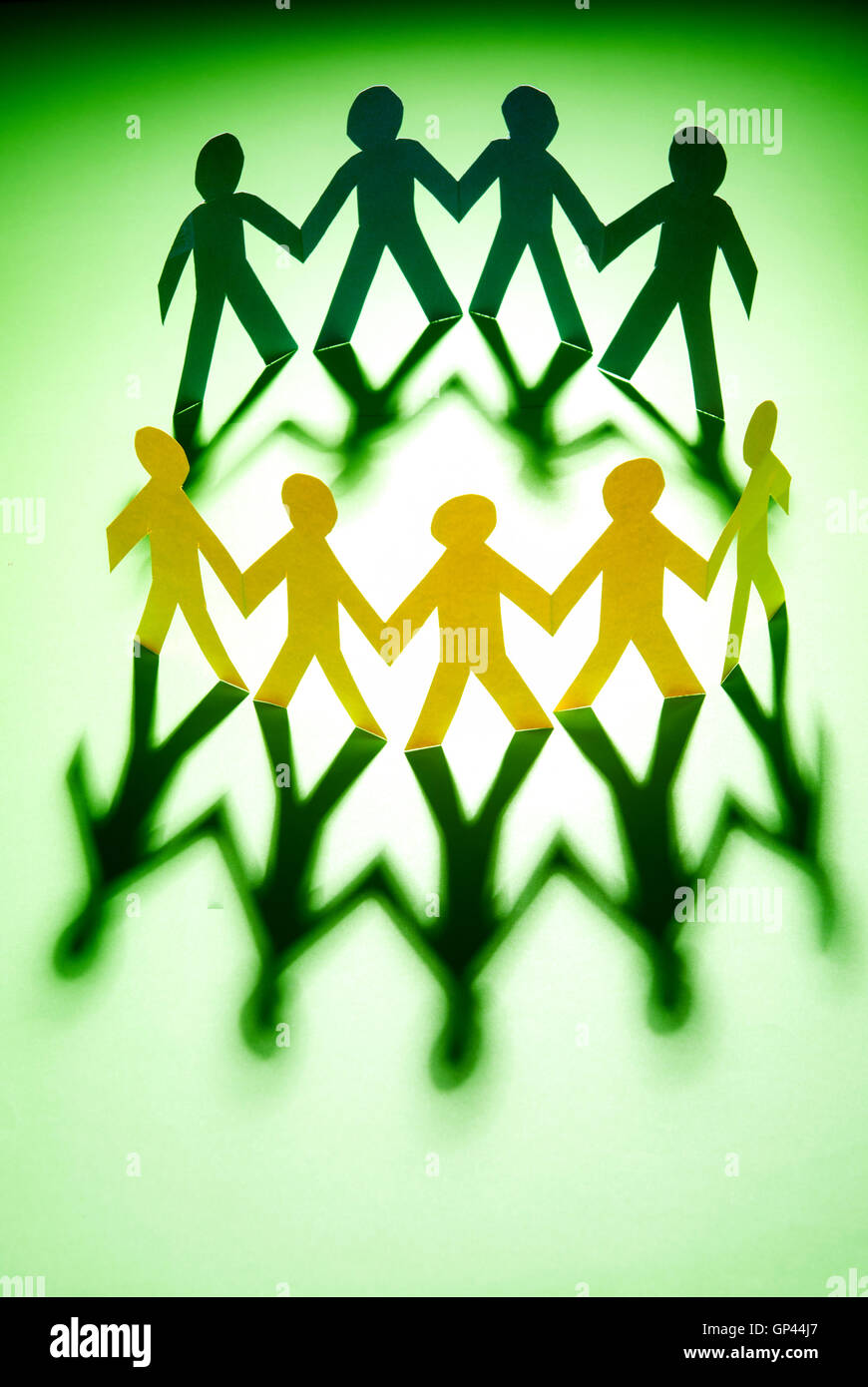 Paper people in teamworking concept Stock Photo - Alamy