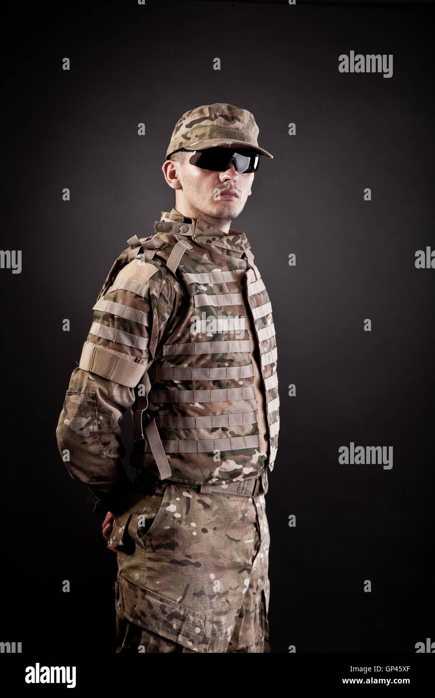 Military man on a black background Stock Photo - Alamy