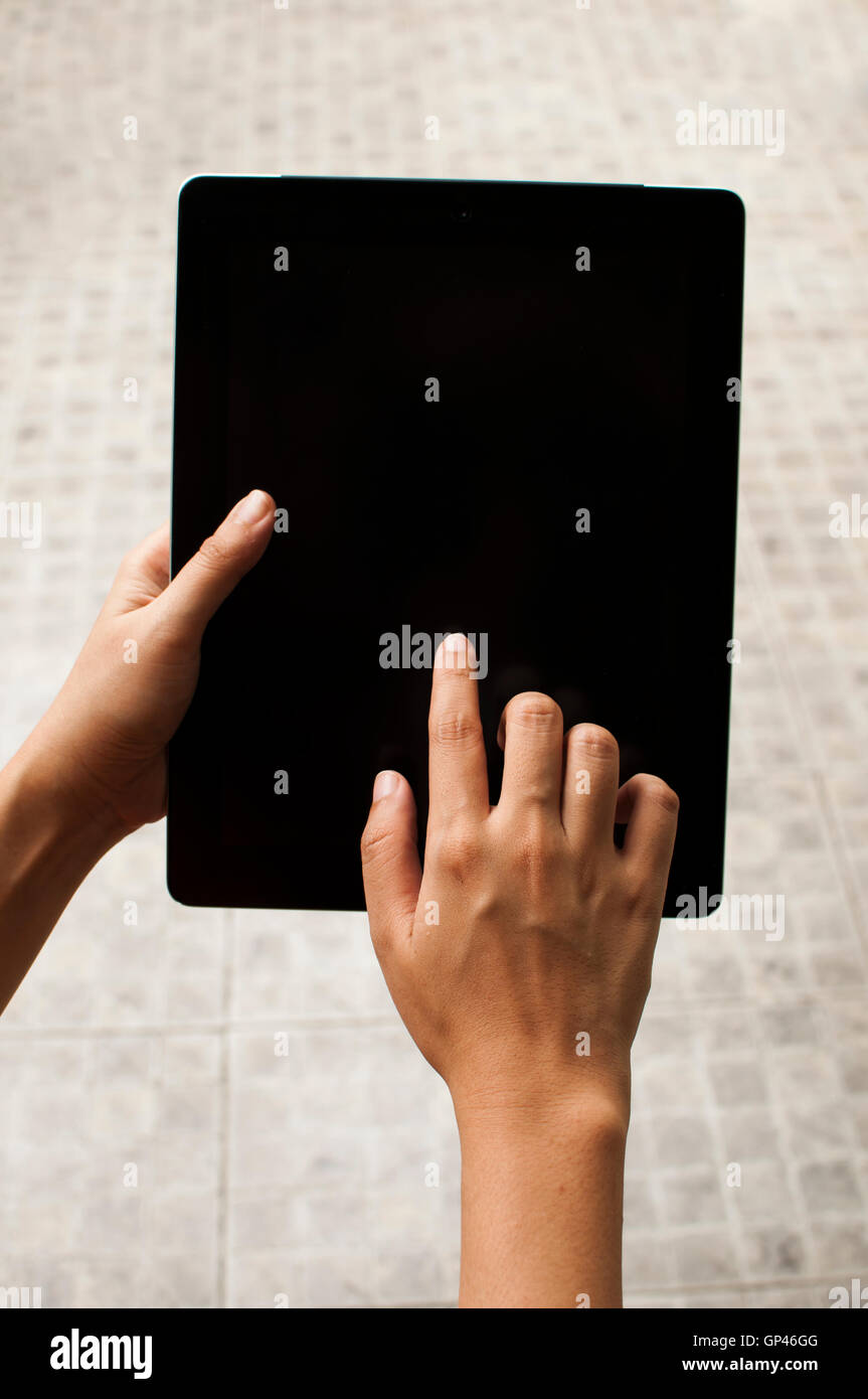 Woman hand with touch screen device Stock Photo - Alamy