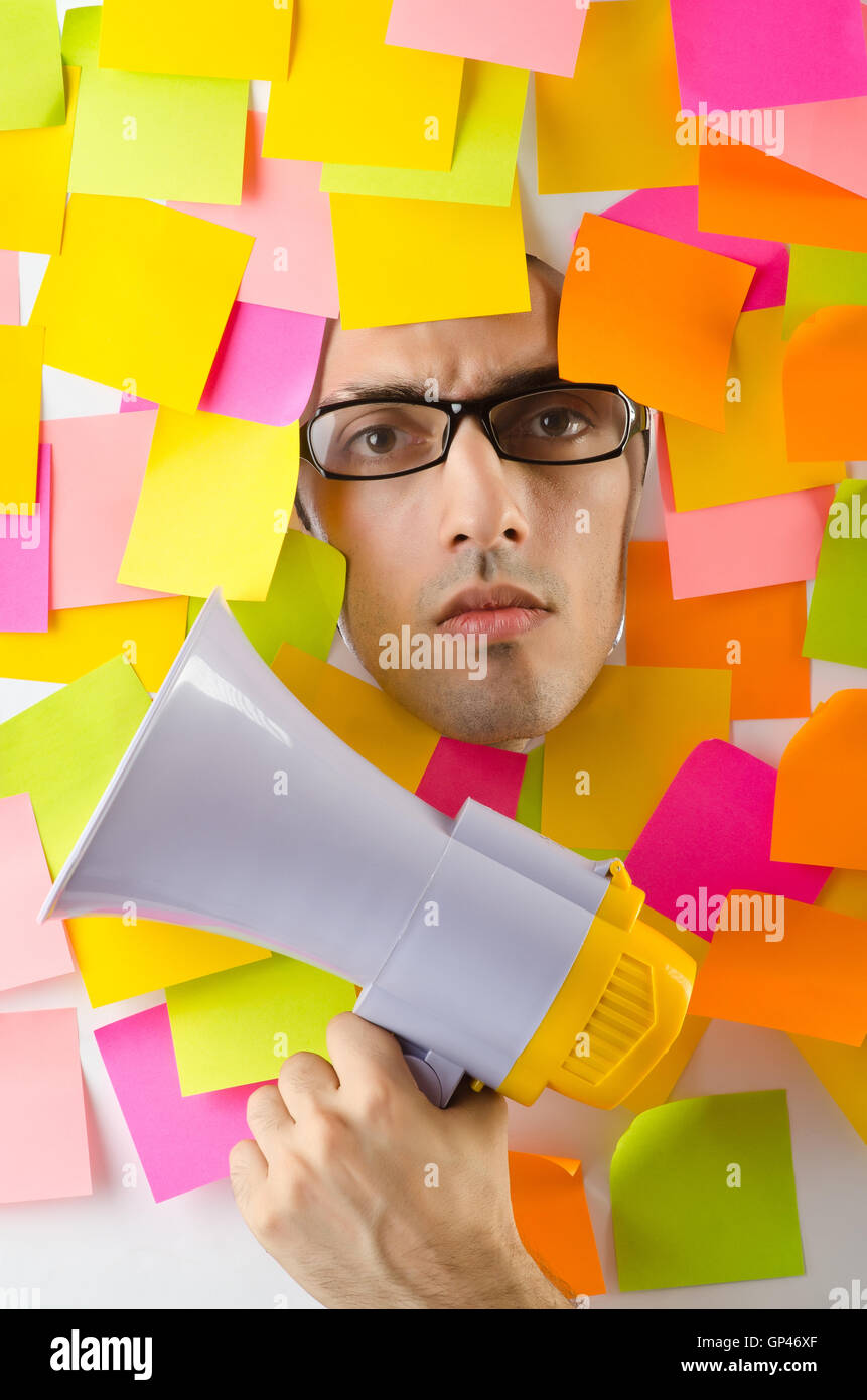 Man's face through paper and reminders Stock Photo - Alamy