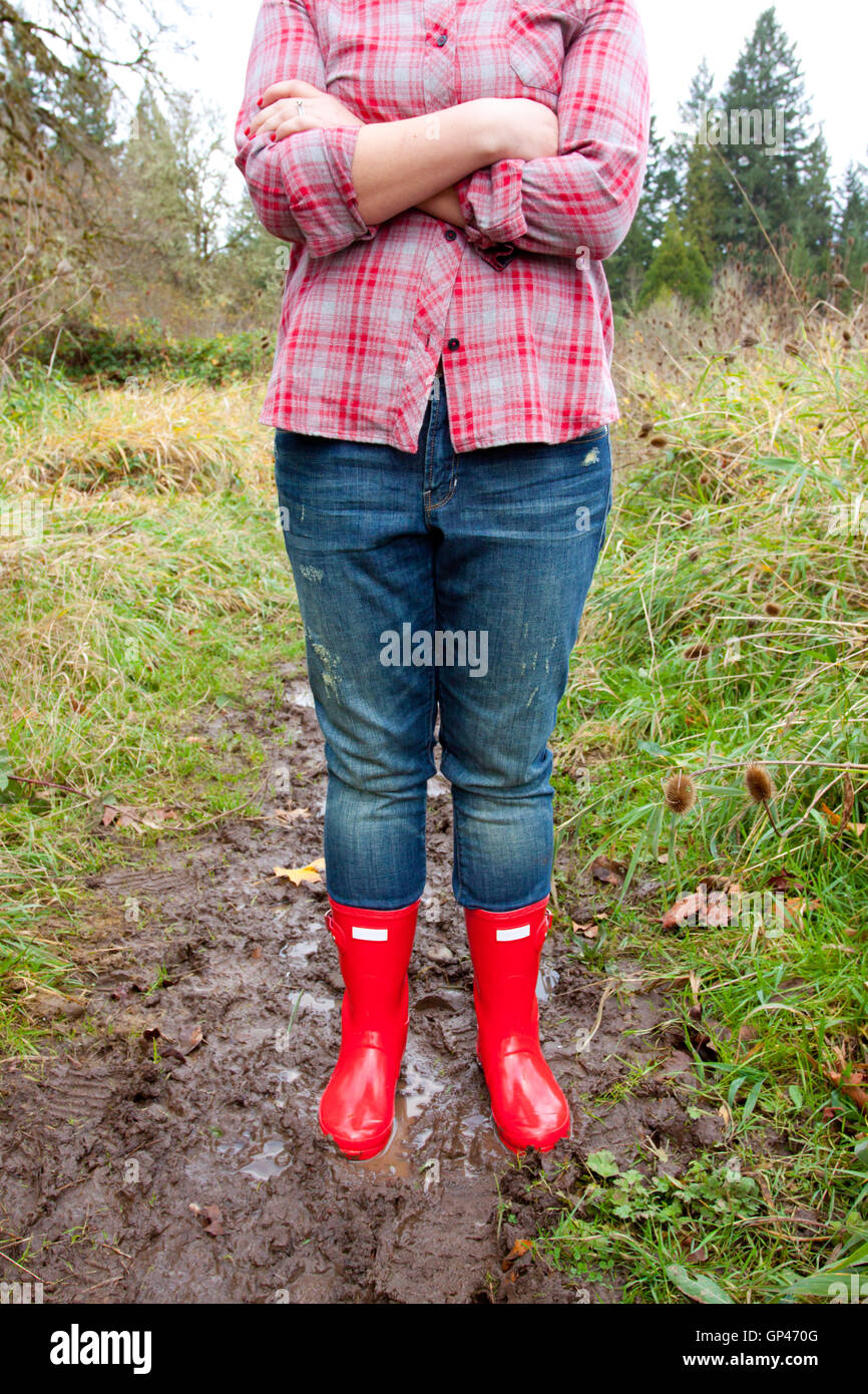Girl wearing rain boots hi-res stock photography and images - Alamy