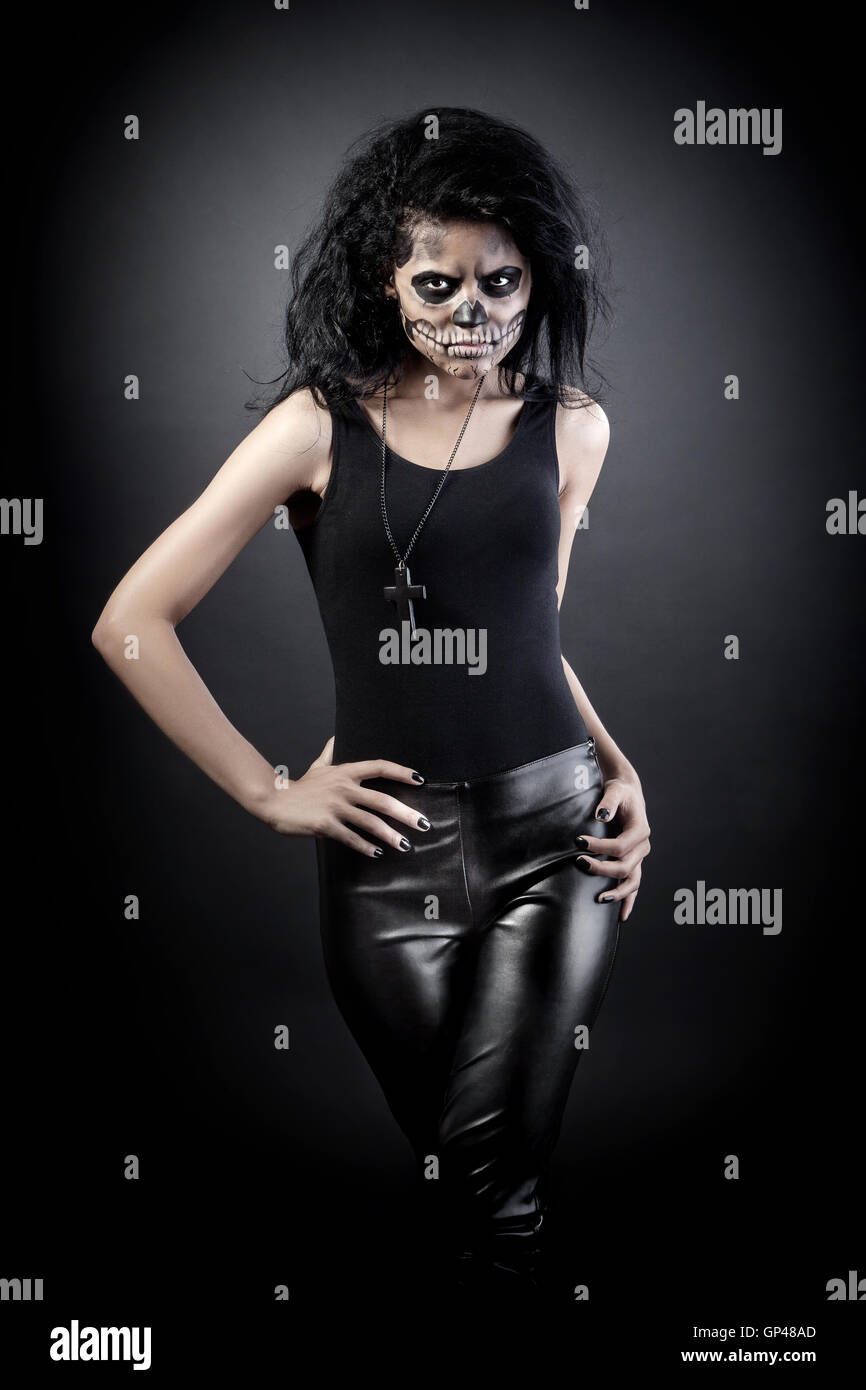 Young woman in day of the dead mask skull. Halloween face art Stock ...