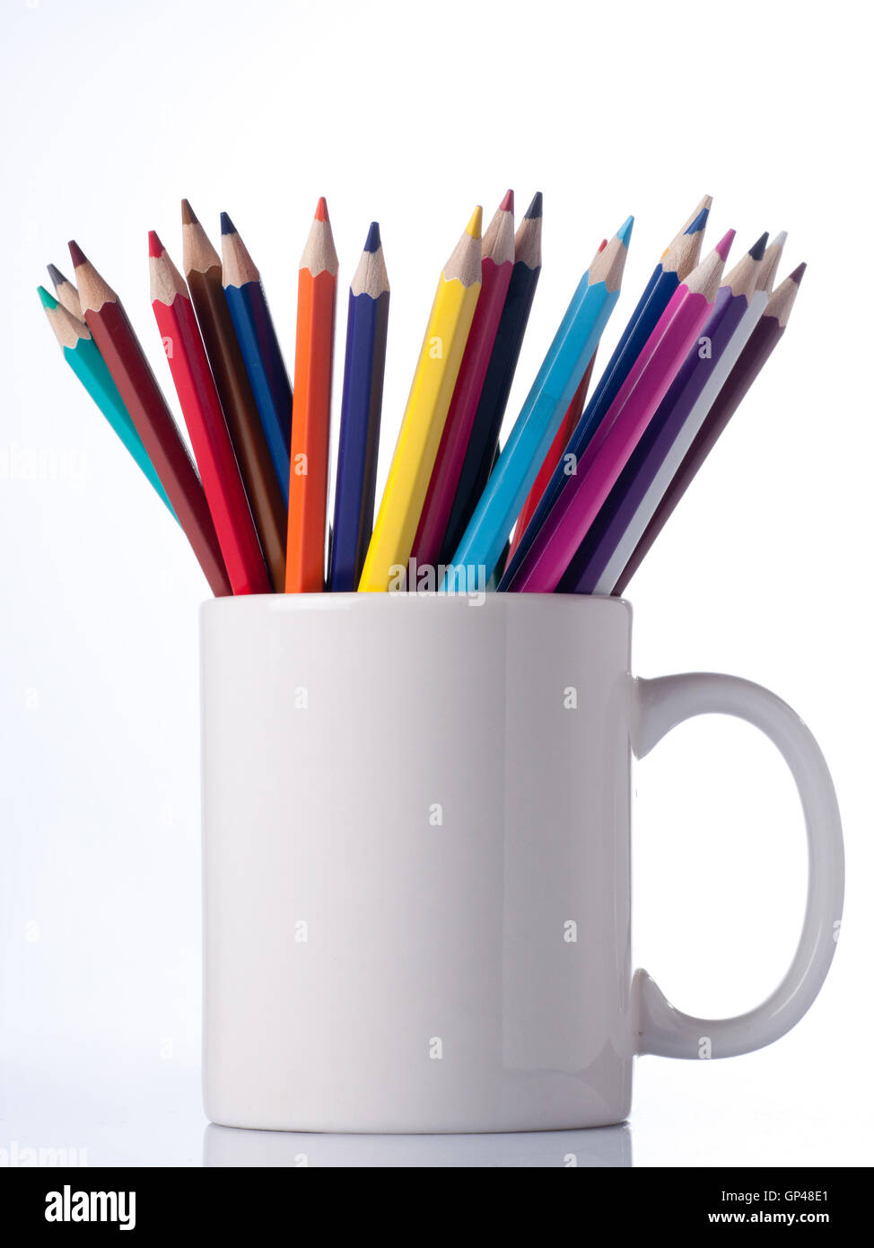 Various colour pencils in cup Stock Photo - Alamy