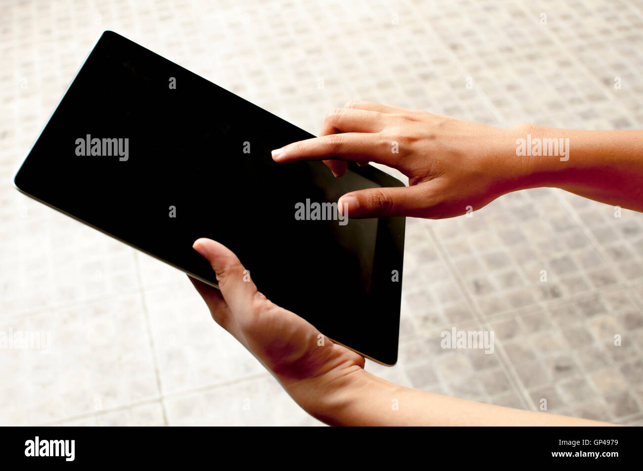 Woman hand with touch screen device Stock Photo - Alamy