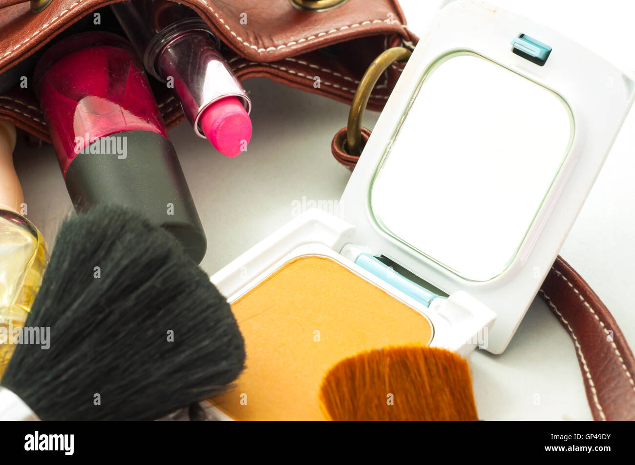 woman leather bag with cosmetics , tools and brushes Stock Photo - Alamy
