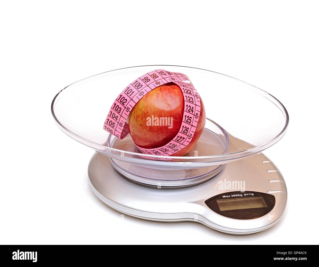 red apple on a scale and measuring tape Stock Photo - Alamy