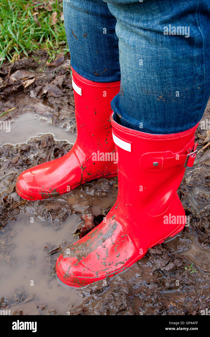Girl wearing rain boots hi-res stock photography and images - Alamy