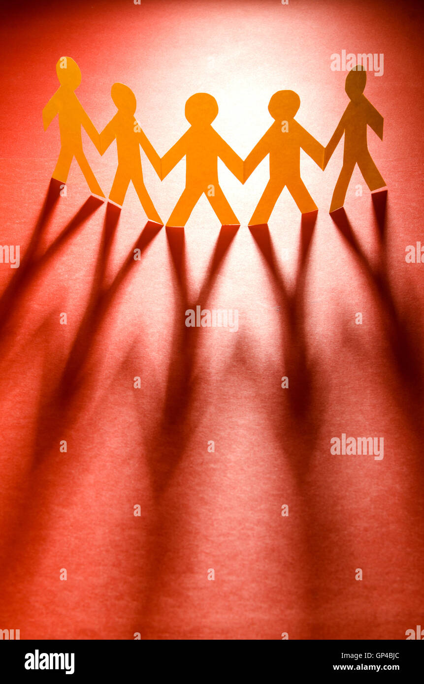 Paper people in teamworking concept Stock Photo - Alamy