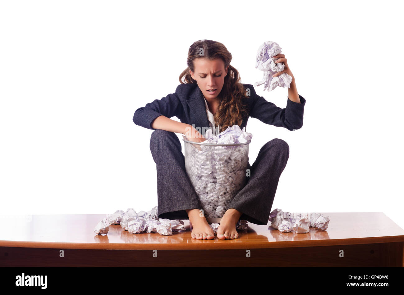 Woman with lots of discarded paper Stock Photo - Alamy