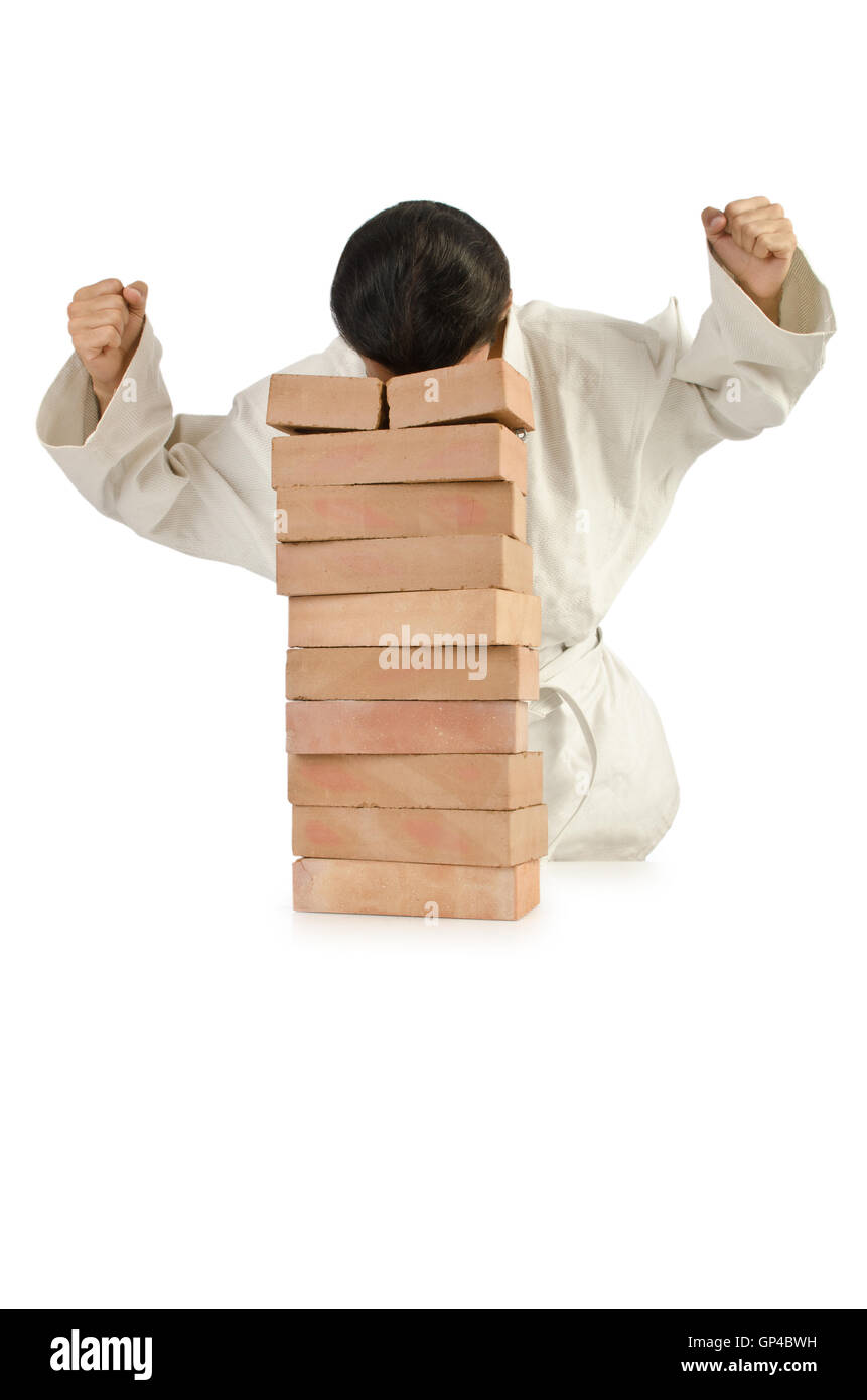 Karate man breaking bricks on white Stock Photo - Alamy