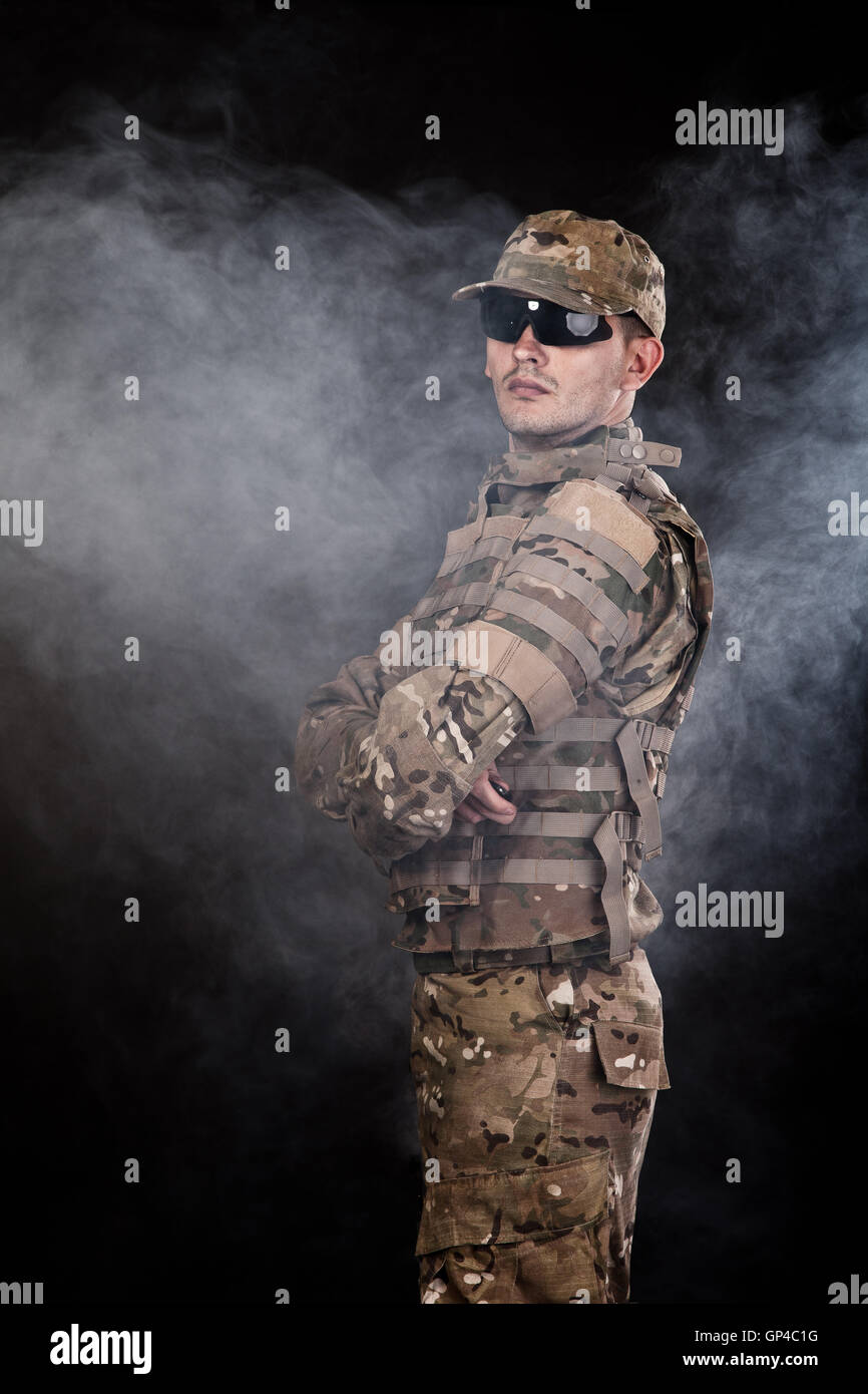 Military man on a black background Stock Photo - Alamy
