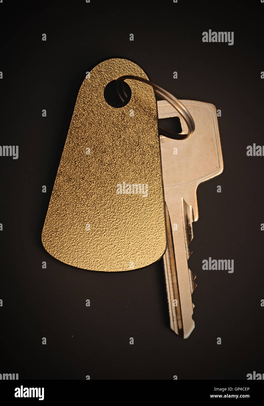 room key on black background Stock Photo - Alamy