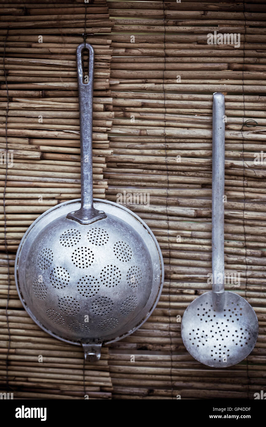 colander and skimmer as a decoration Stock Photo - Alamy