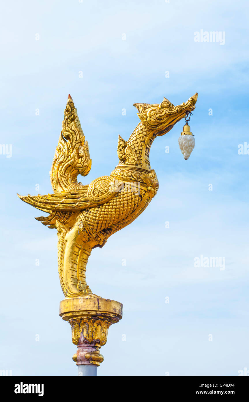 Golden statue of creature Stock Photo - Alamy
