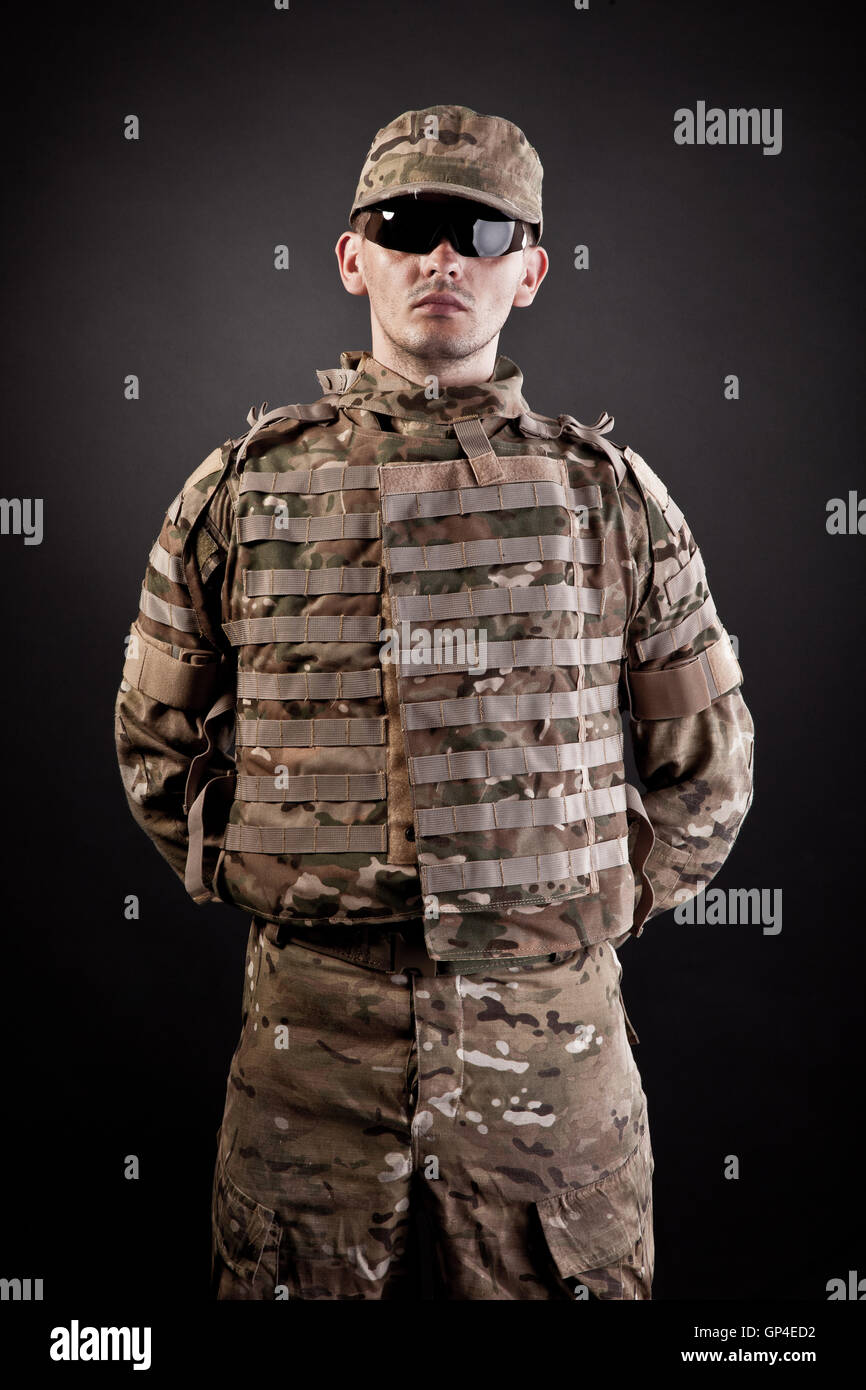 Military man on a black background Stock Photo - Alamy