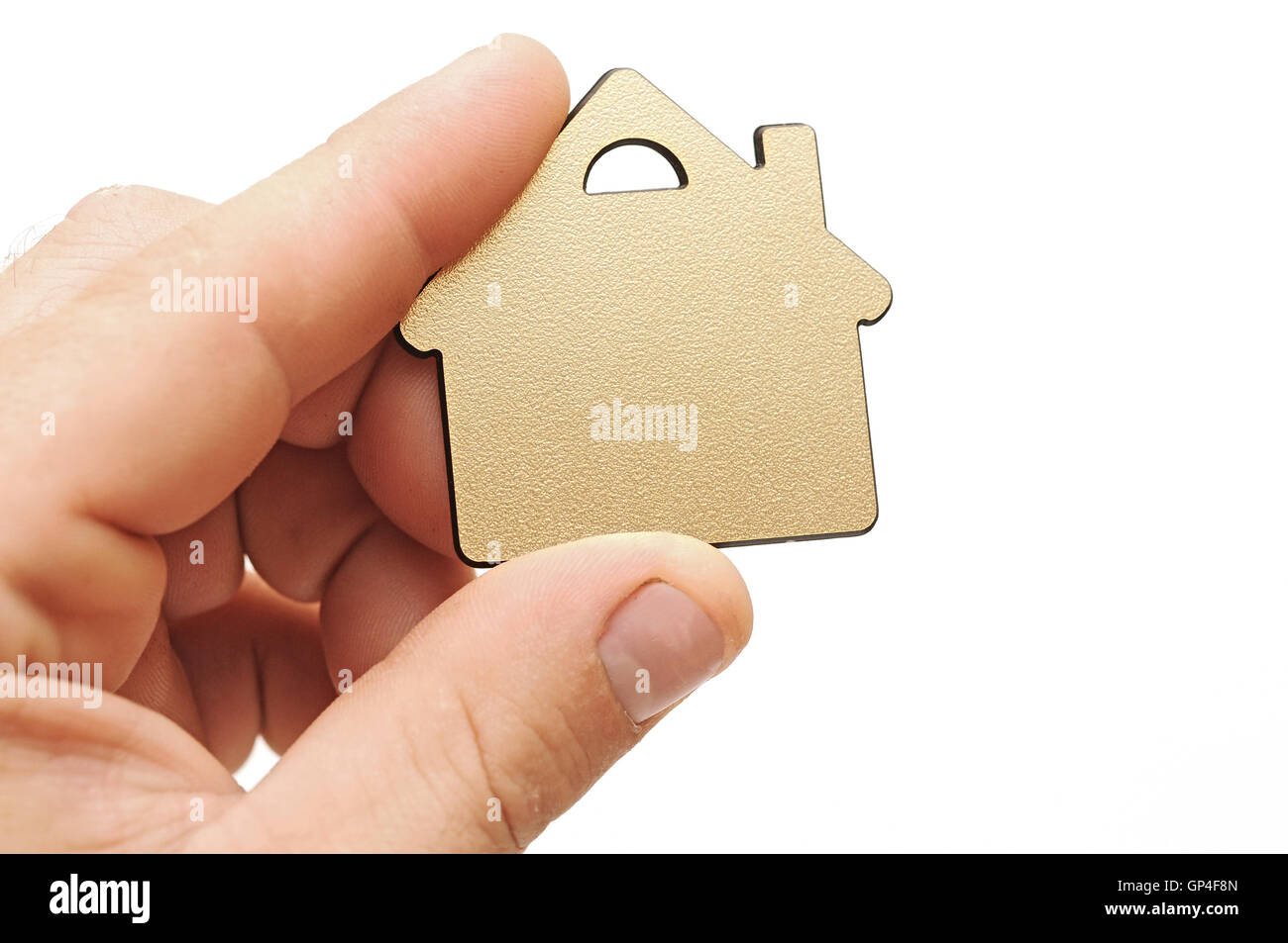 golden metallic small house in hand Stock Photo - Alamy