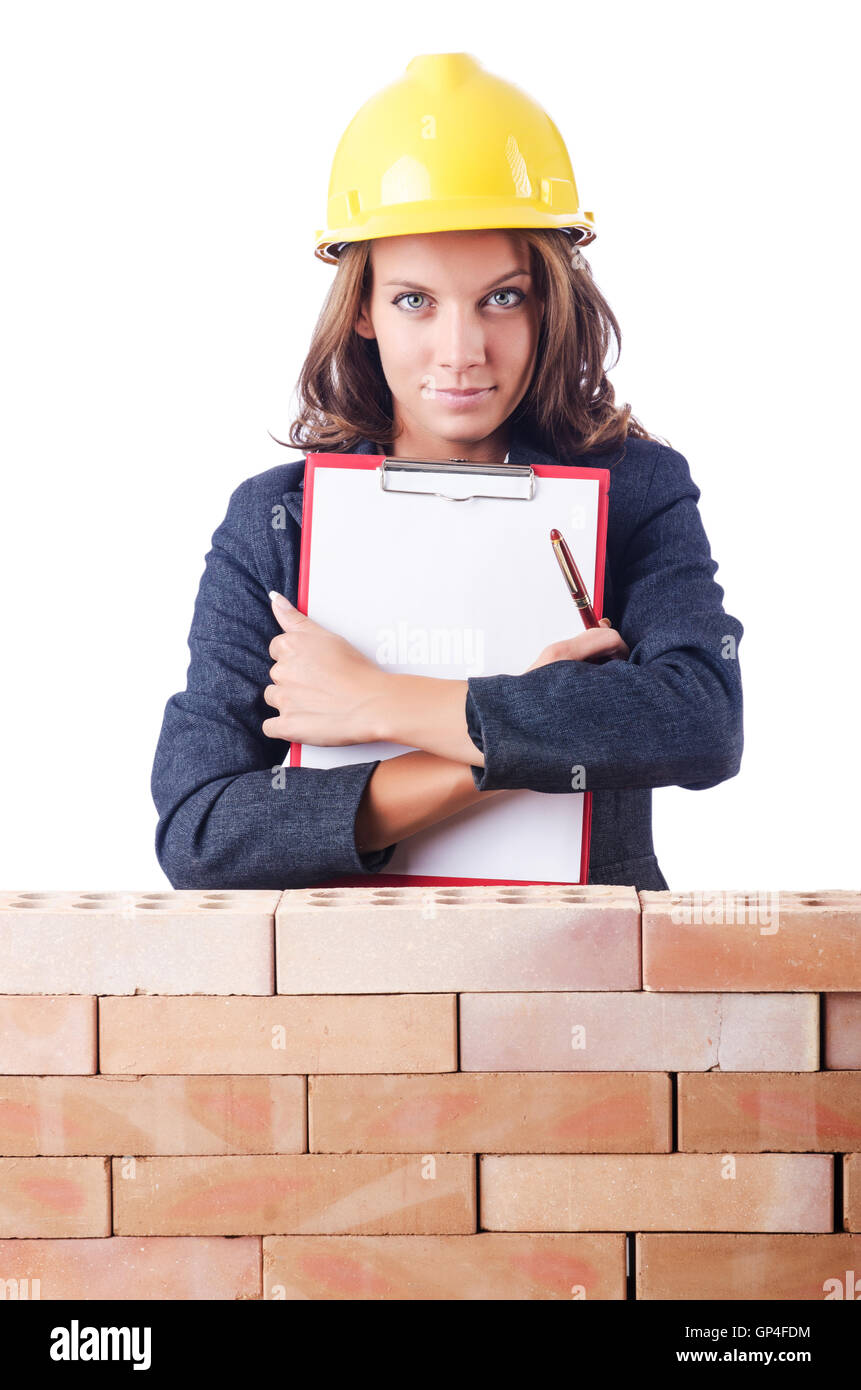 Woman builder and brick wall Stock Photo - Alamy