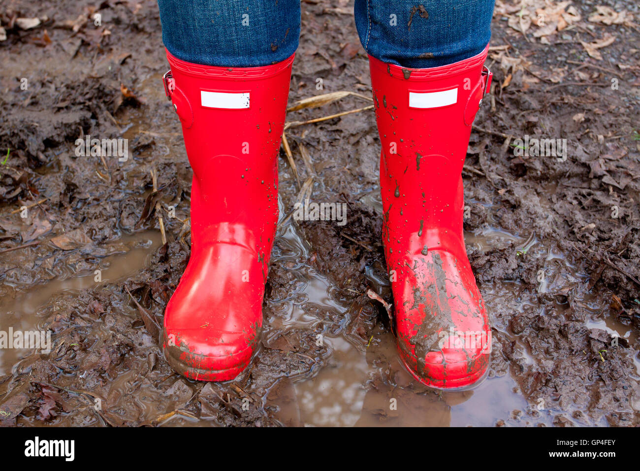 Girl wearing rain boots hi-res stock photography and images - Alamy