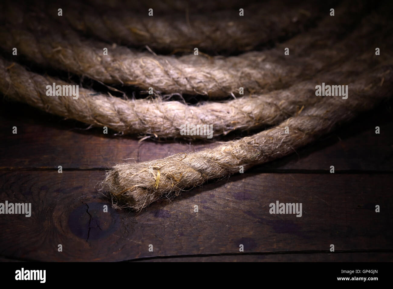 Rope On Wood Stock Photo - Alamy