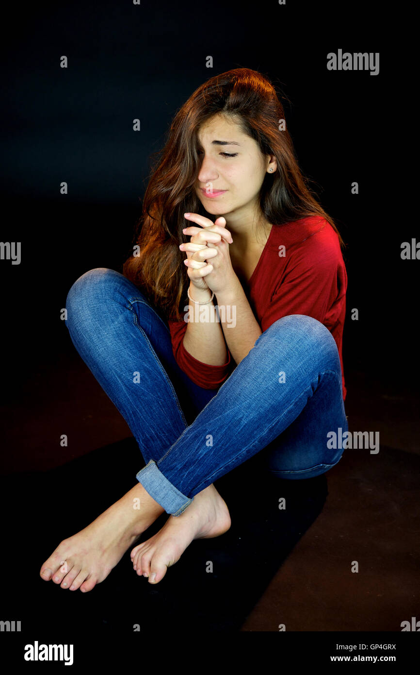 Desperate sad woman praying for help Stock Photo - Alamy